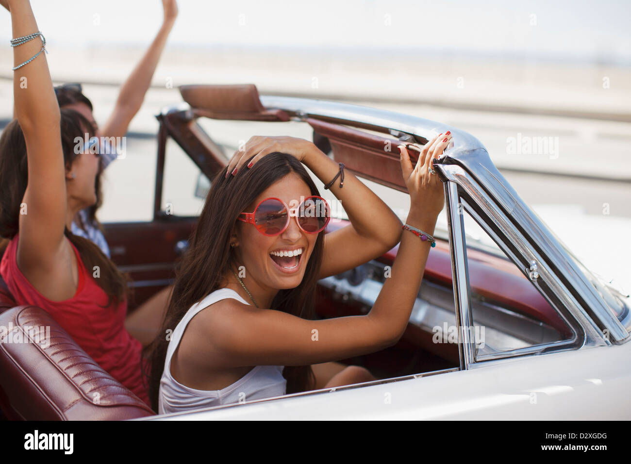 Smiling women driving convertible Stock Photo - Alamy