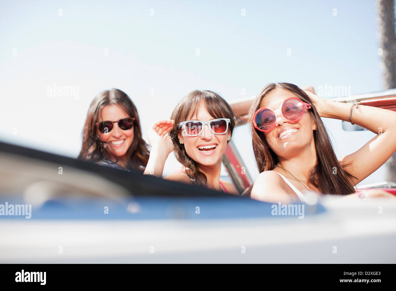 Smiling women driving convertible Stock Photo - Alamy