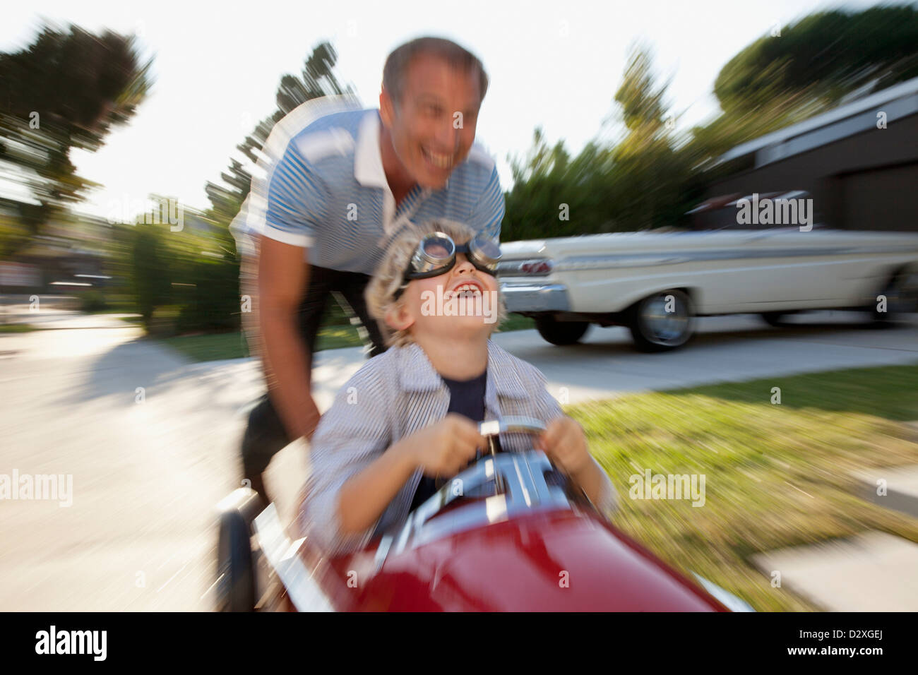 Boys pushing cart hi-res stock photography and images - Alamy