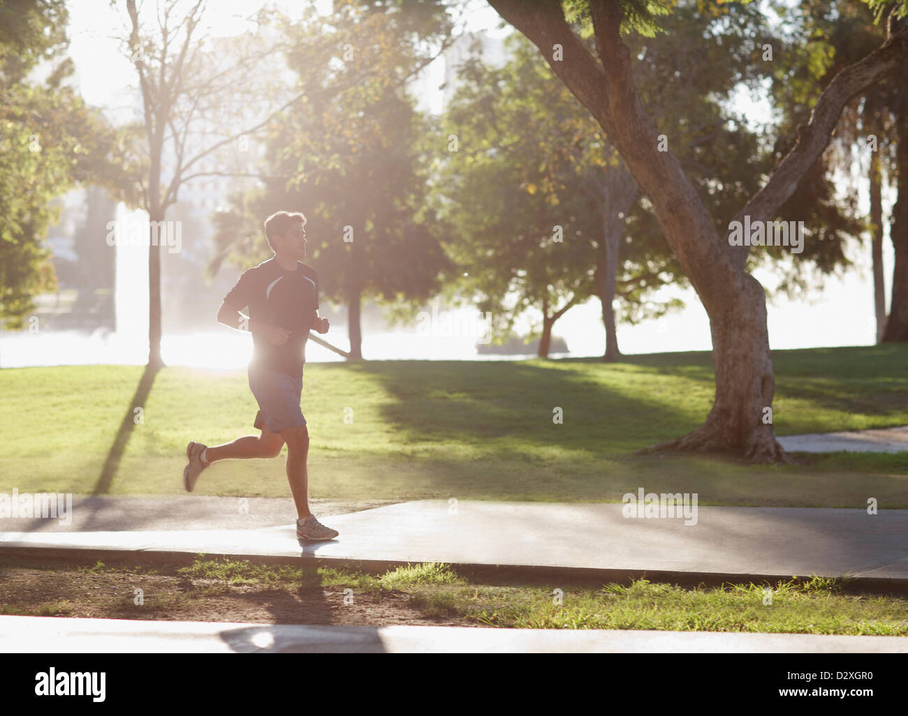Man jogging in park Stock Photo - Alamy