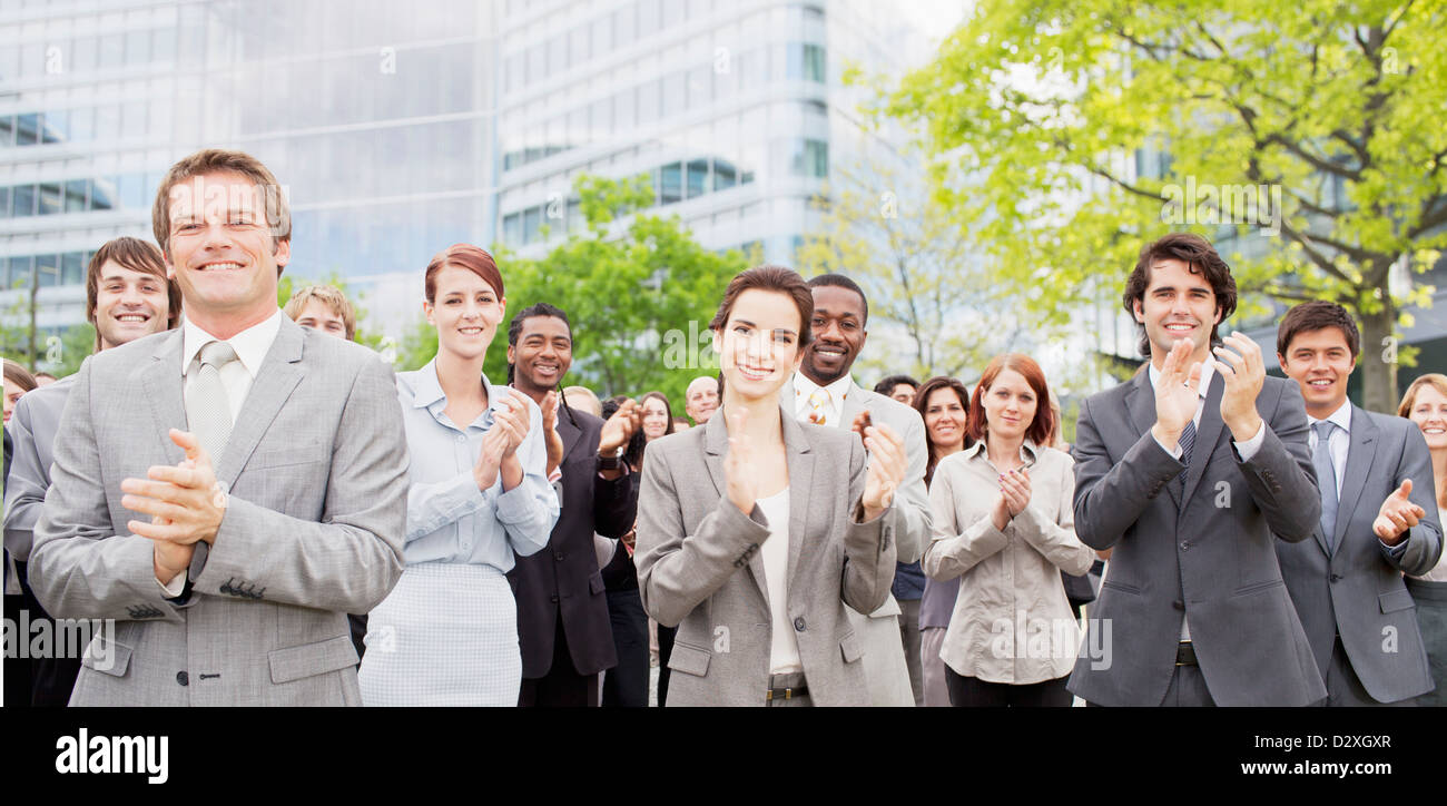Portrait of clapping business people in crowd Stock Photo - Alamy