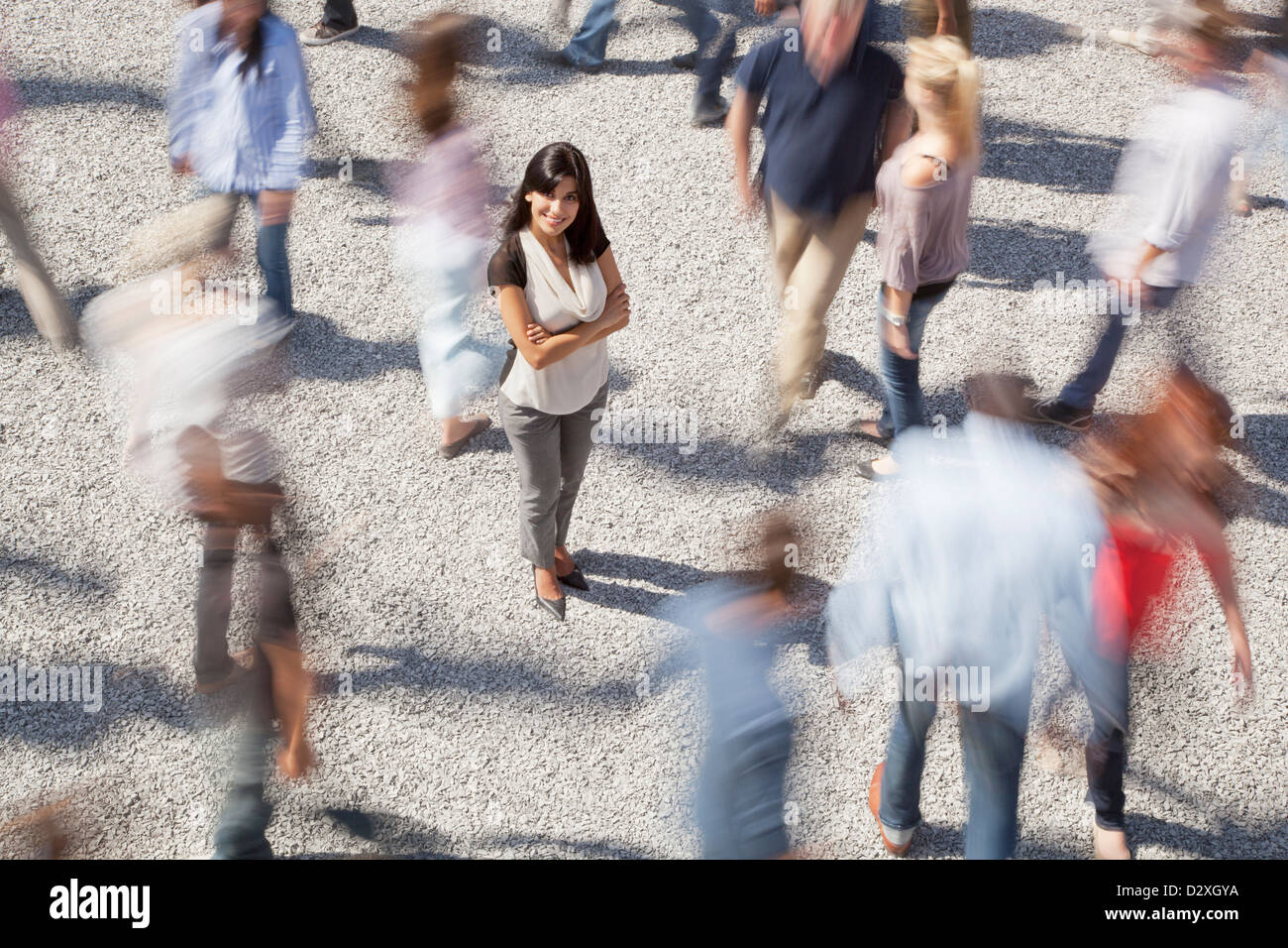 Woman standing among rushing crowd hi-res stock photography and images ...