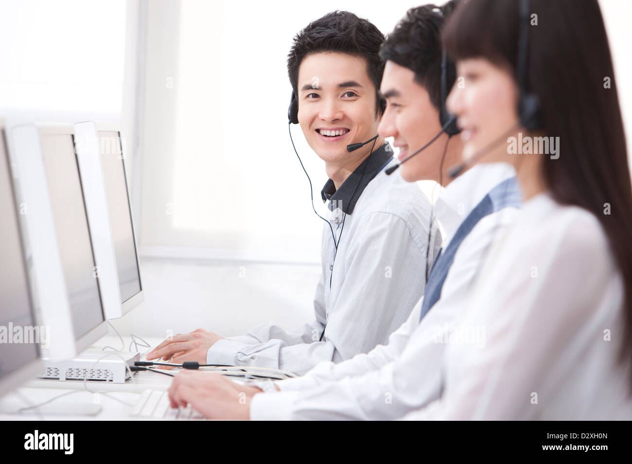 Professional customer service staff in office Stock Photo - Alamy