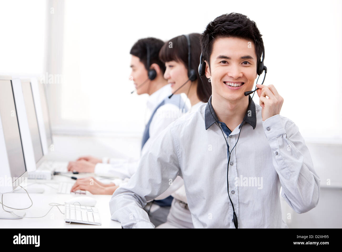 Professional customer service staff in office Stock Photo - Alamy
