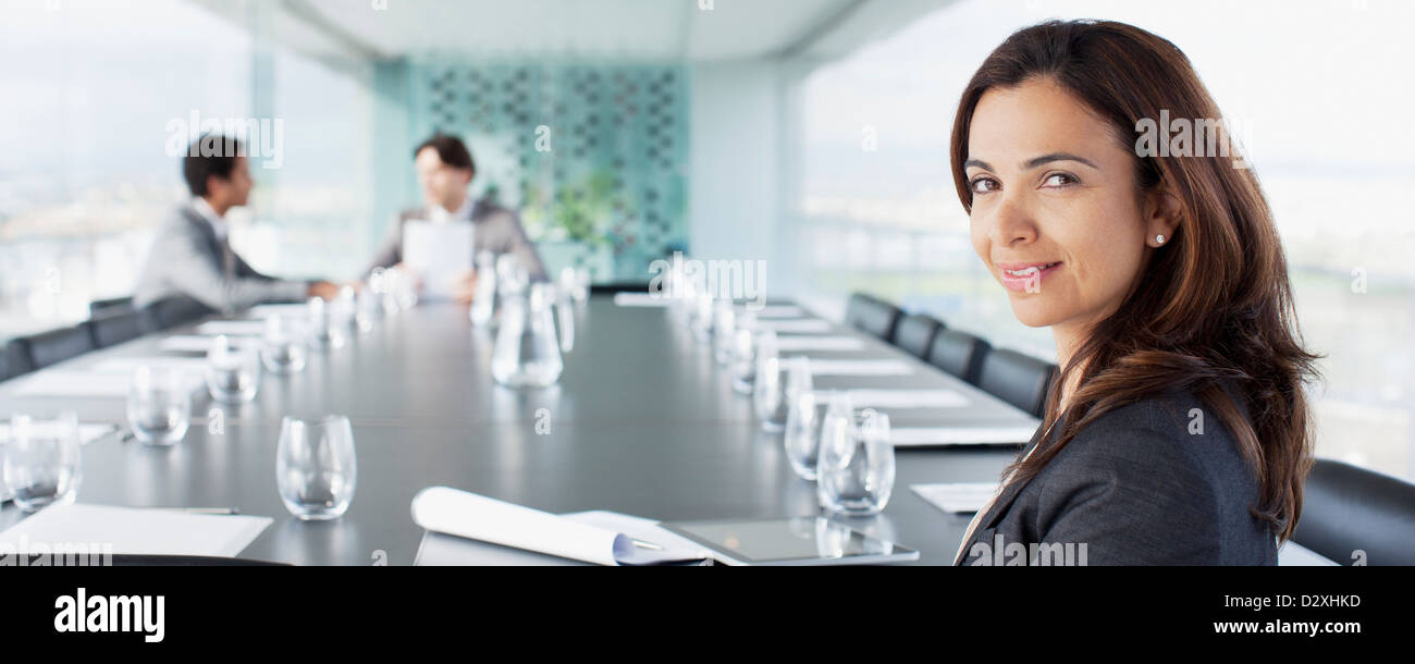 Portrait of smiling businesswoman in conference room Stock Photo - Alamy
