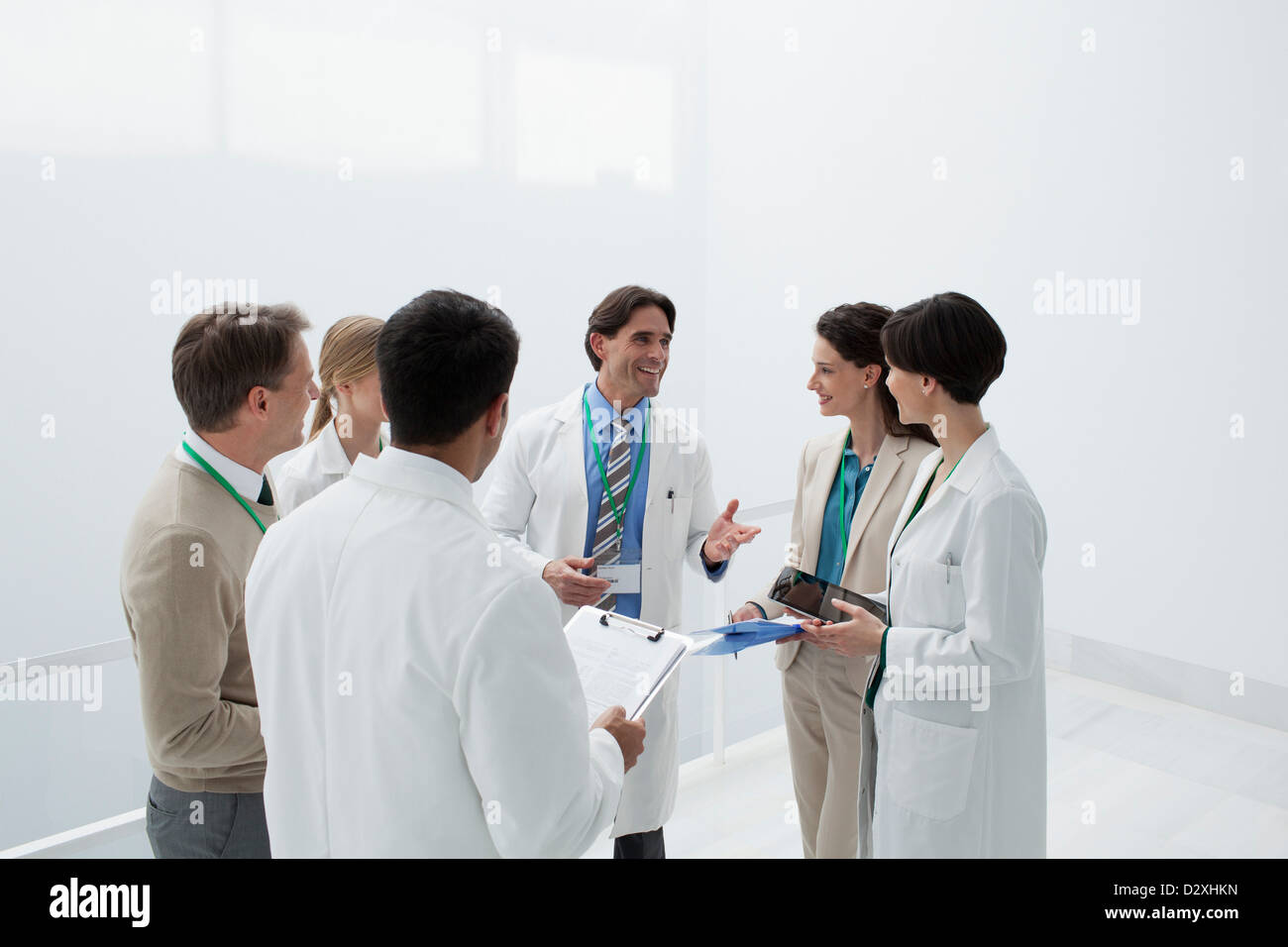 Smiling doctors discussing medical charts Stock Photo - Alamy