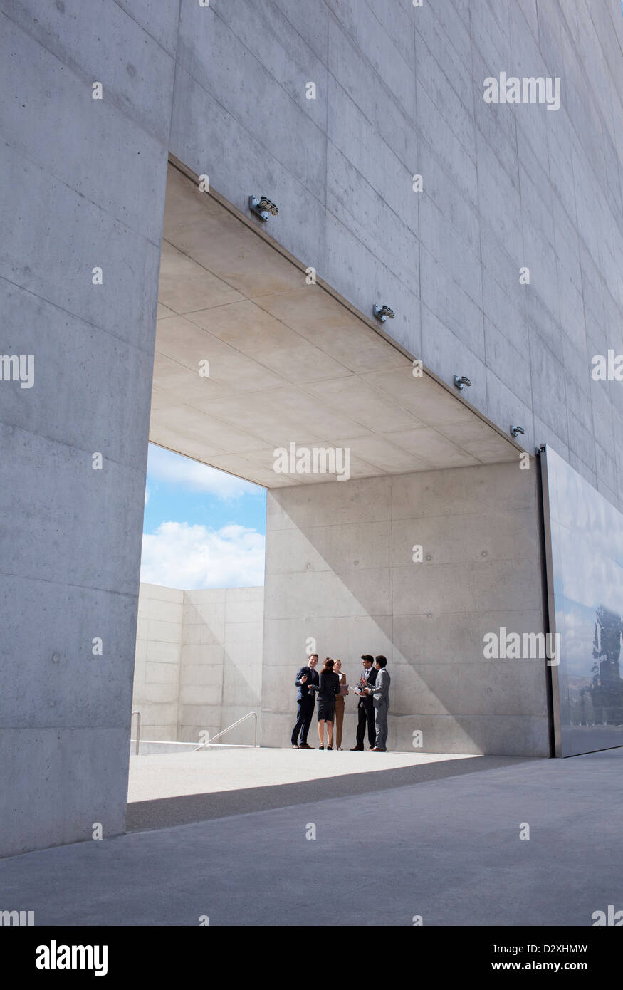 Business people meeting outside modern building Stock Photo - Alamy
