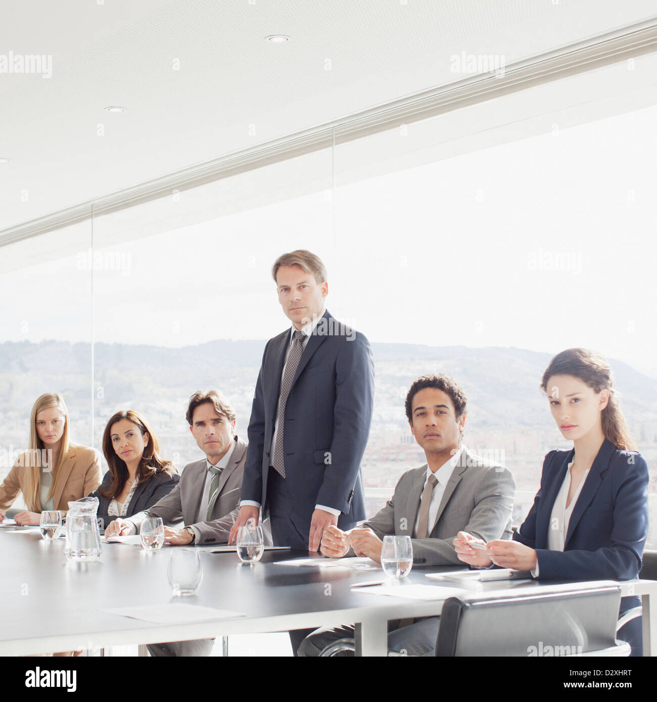 Portrait of confident business people in conference room Stock Photo ...