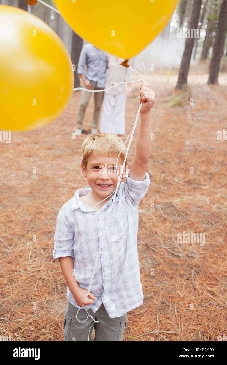 Boy with balloons hi-res stock photography and images - Alamy