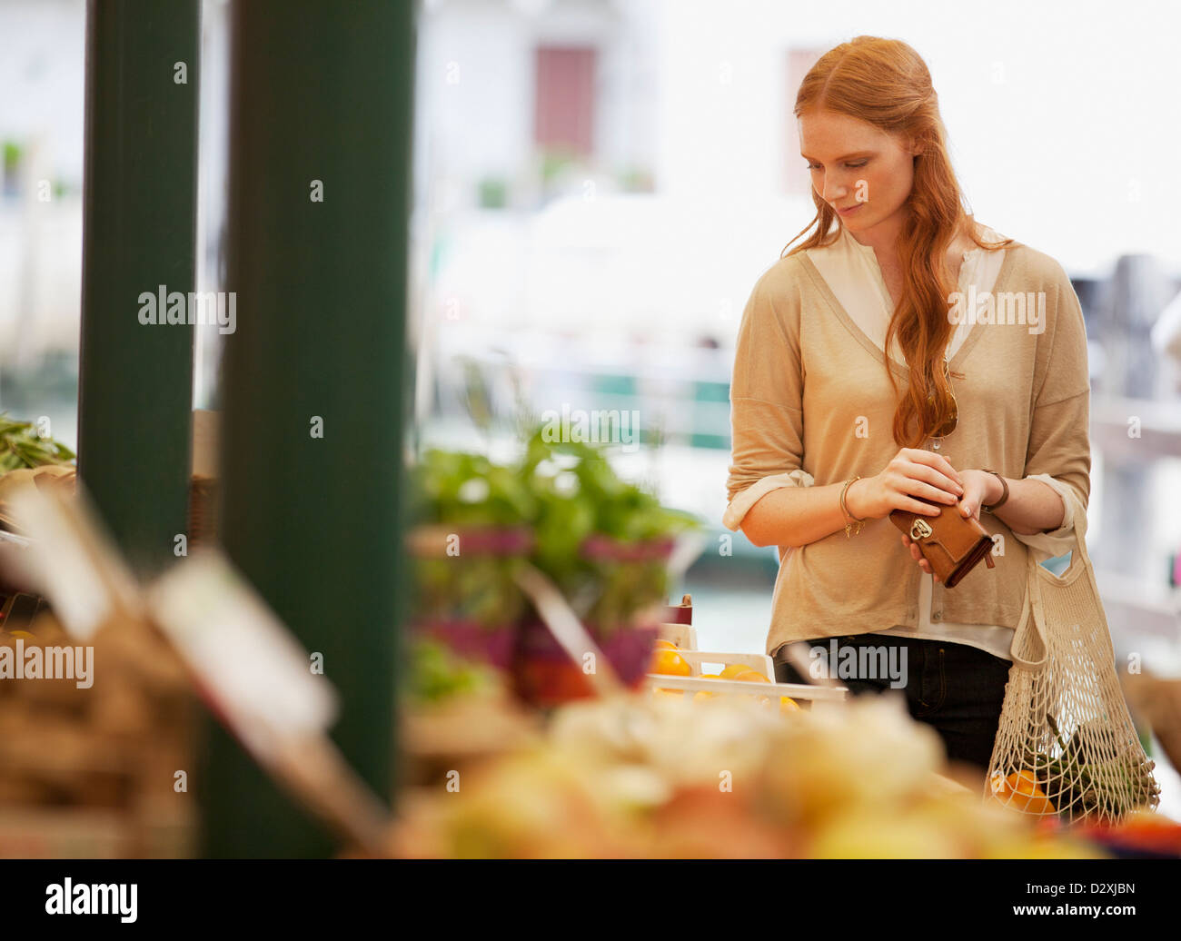 Woman shopping in outdoor market Stock Photo - Alamy