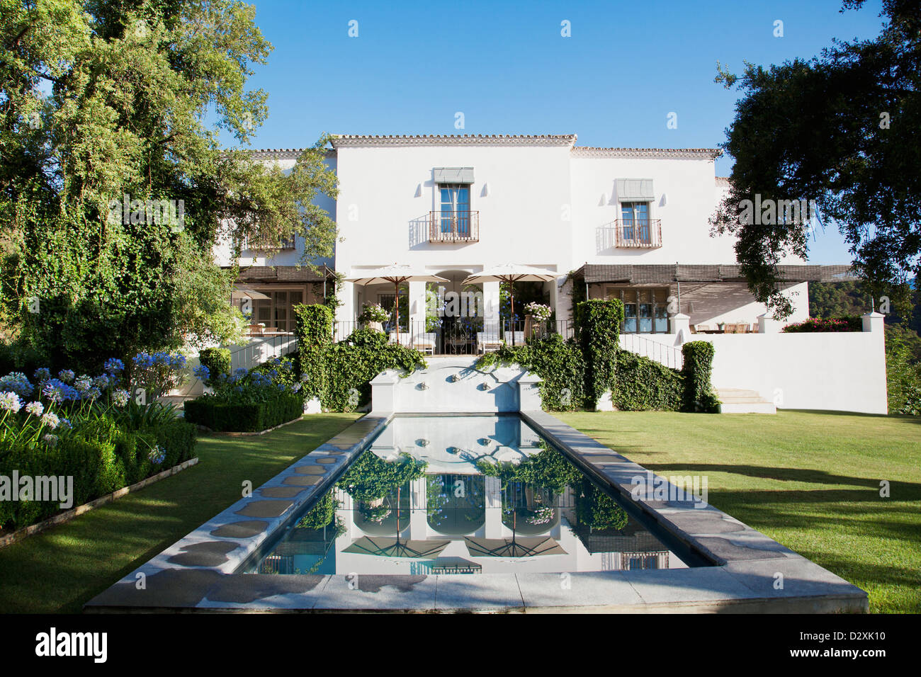 Luxury lap pool and Spanish villa Stock Photo - Alamy