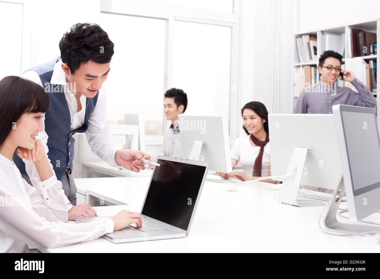 Busy office workers in studio Stock Photo - Alamy