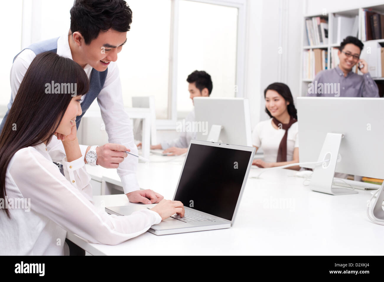 Busy office workers in studio Stock Photo - Alamy