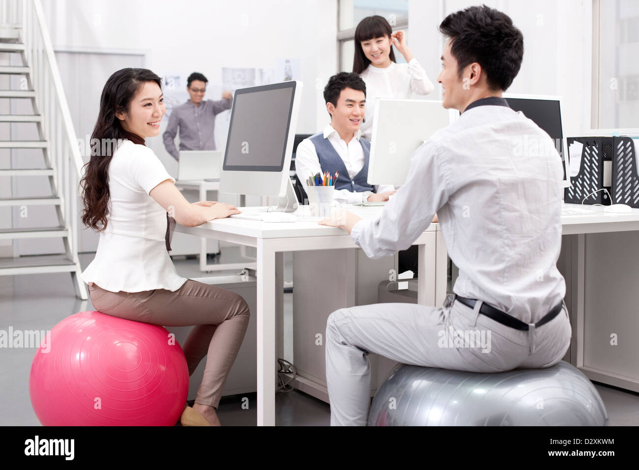 Cheerful office workers in studio Stock Photo - Alamy