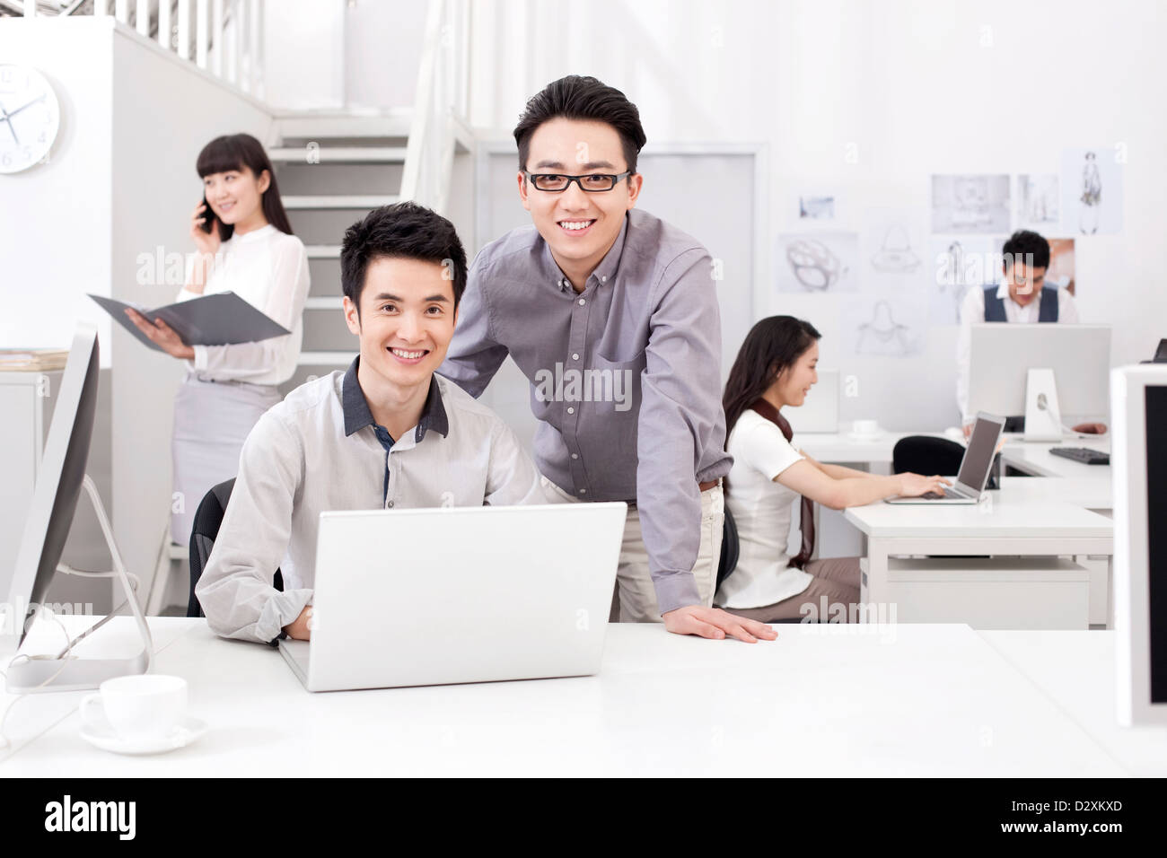 Busy office workers in studio Stock Photo - Alamy