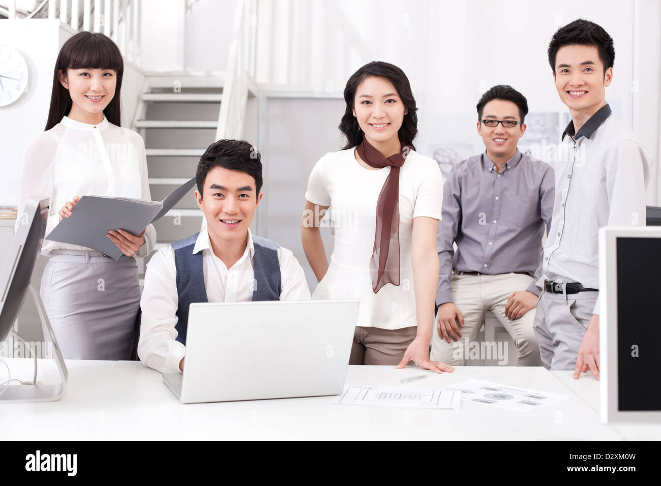 Portrait of happy office workers in studio Stock Photo - Alamy