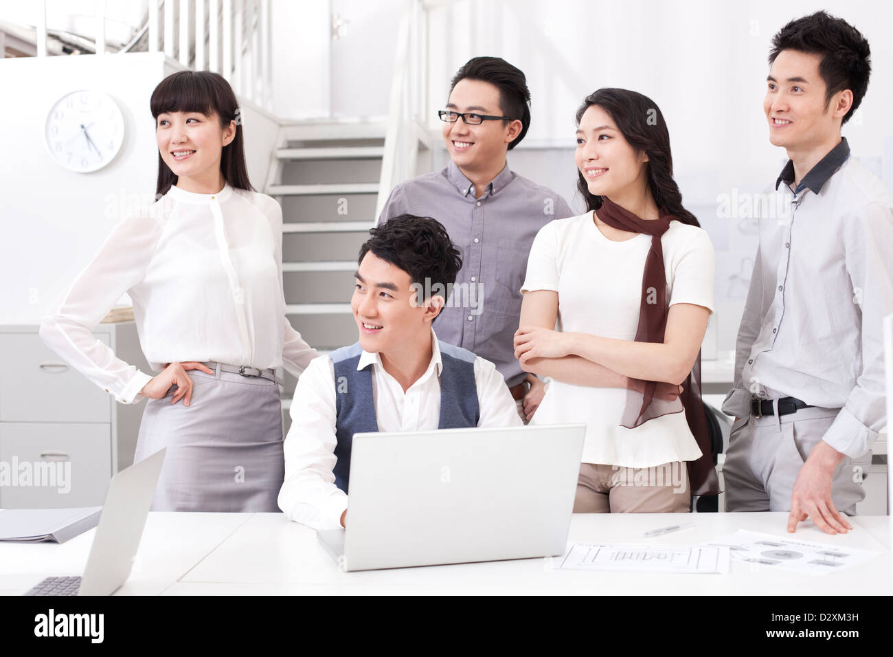 Happy office workers in studio Stock Photo - Alamy