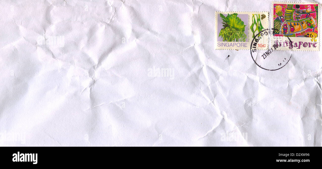 SINGAPORE - CIRCA 2012: Mailing envelope with postage stamps dedicated ...