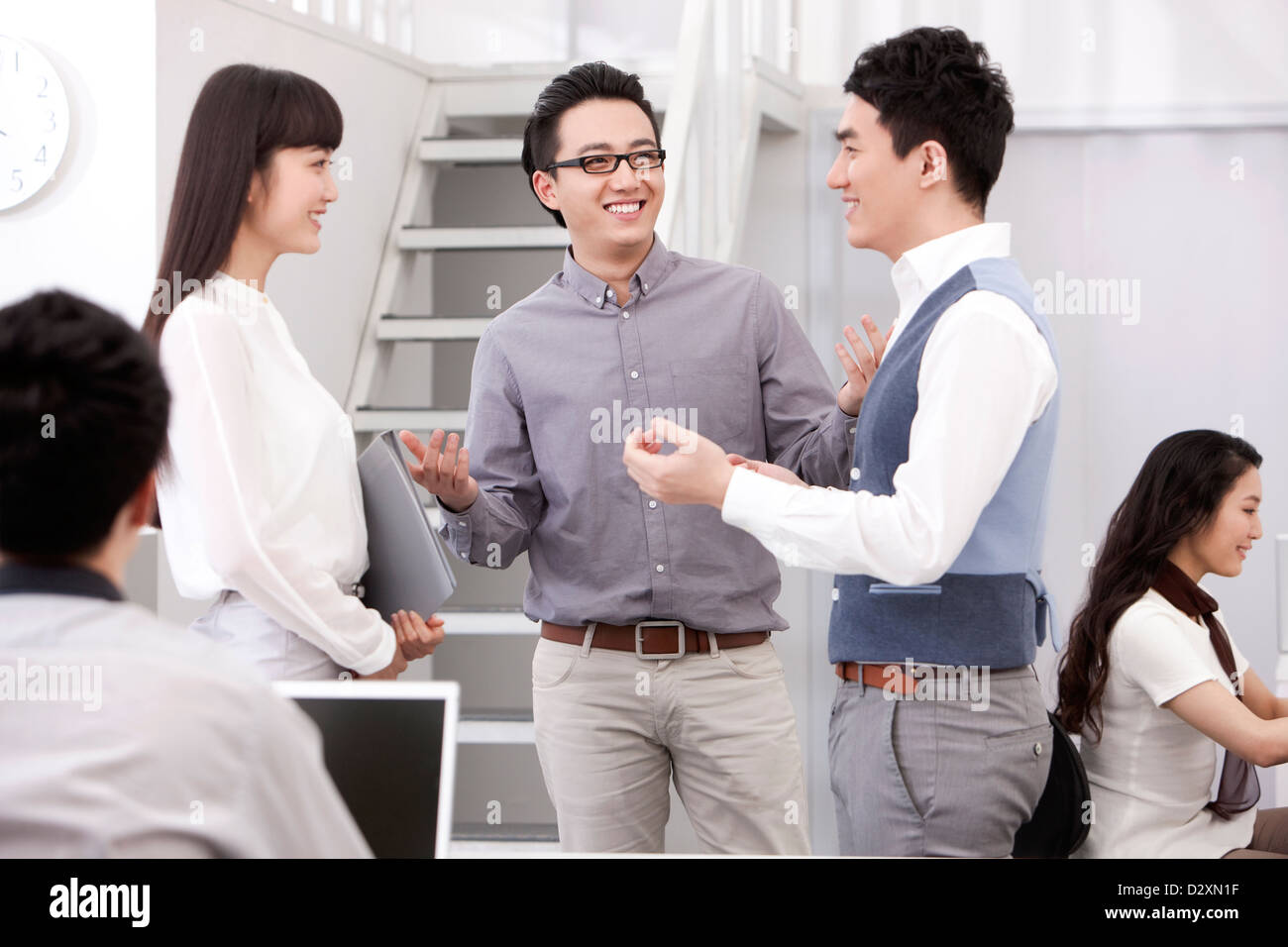 Cheerful office workers discussing hi-res stock photography and images ...