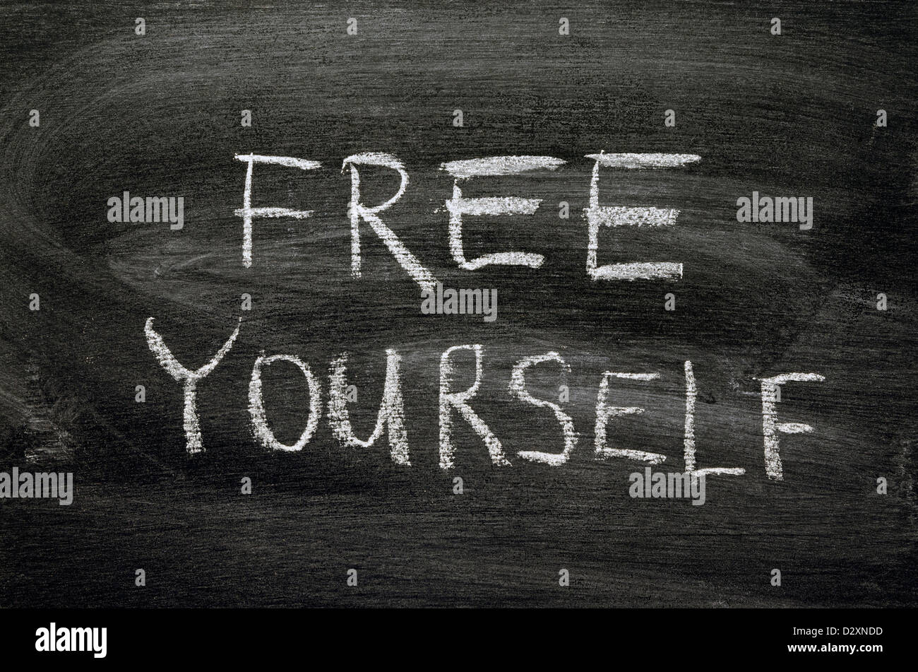 free yourself phrase handwritten on school blackboard Stock Photo - Alamy