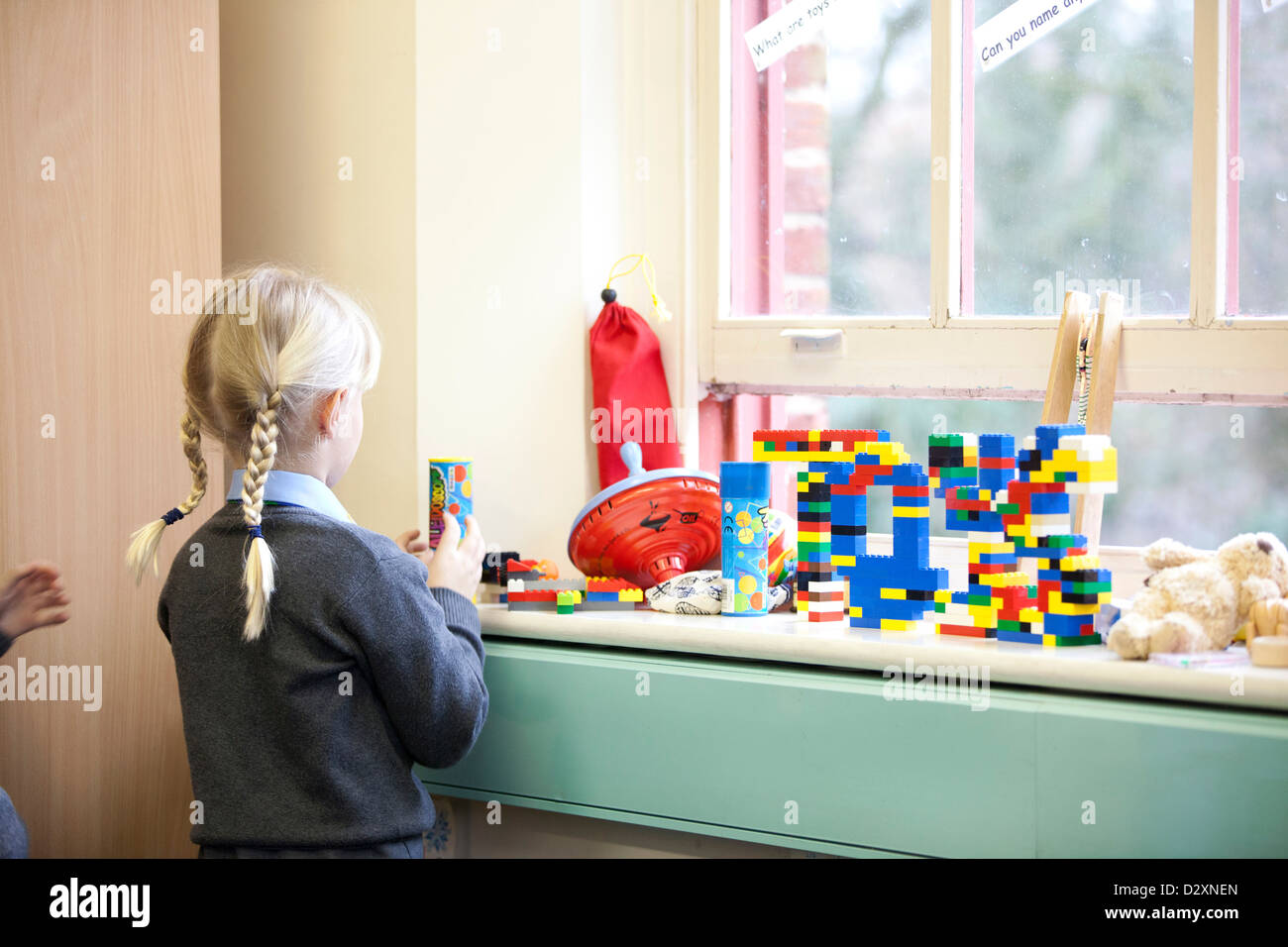 girl in primary school classroom playing with building blocks Stock ...