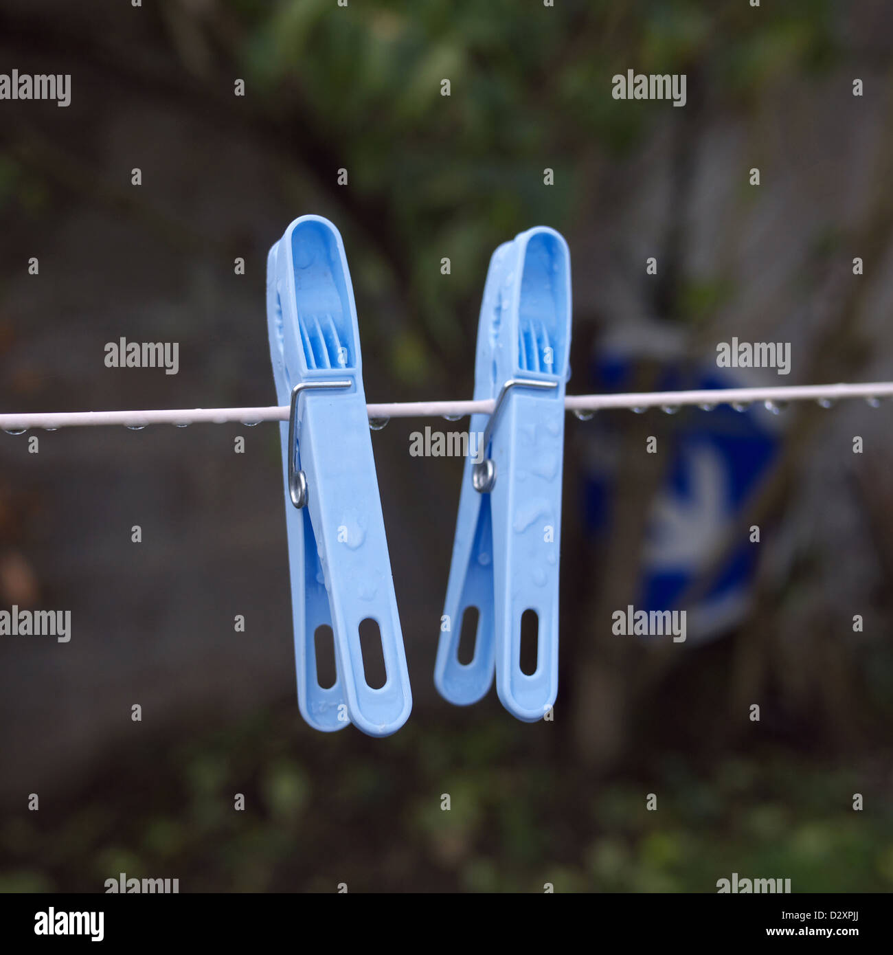 two blue clothespins Stock Photo - Alamy