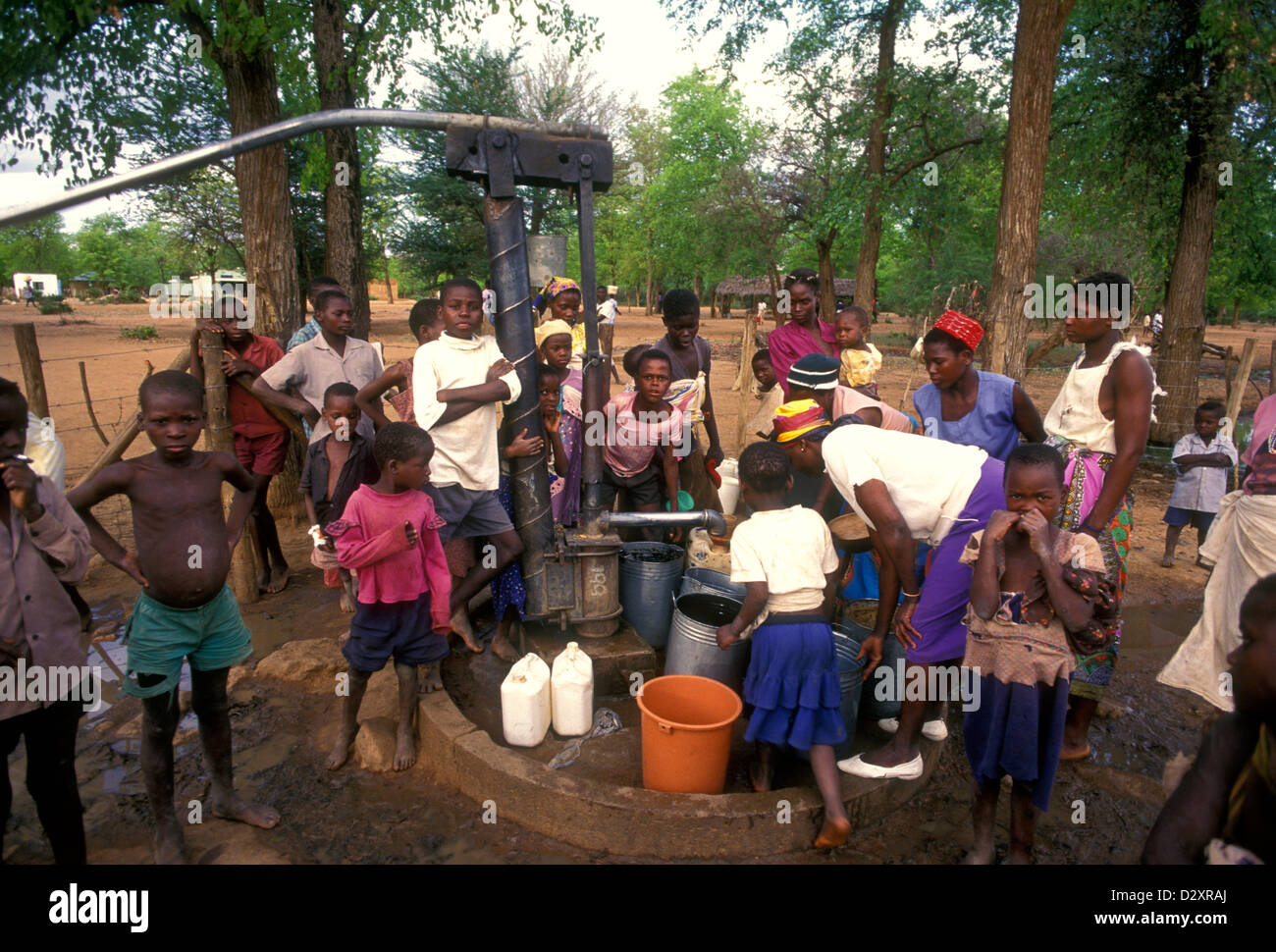Zimbabwean people, women and children, pumping water from well, water ...
