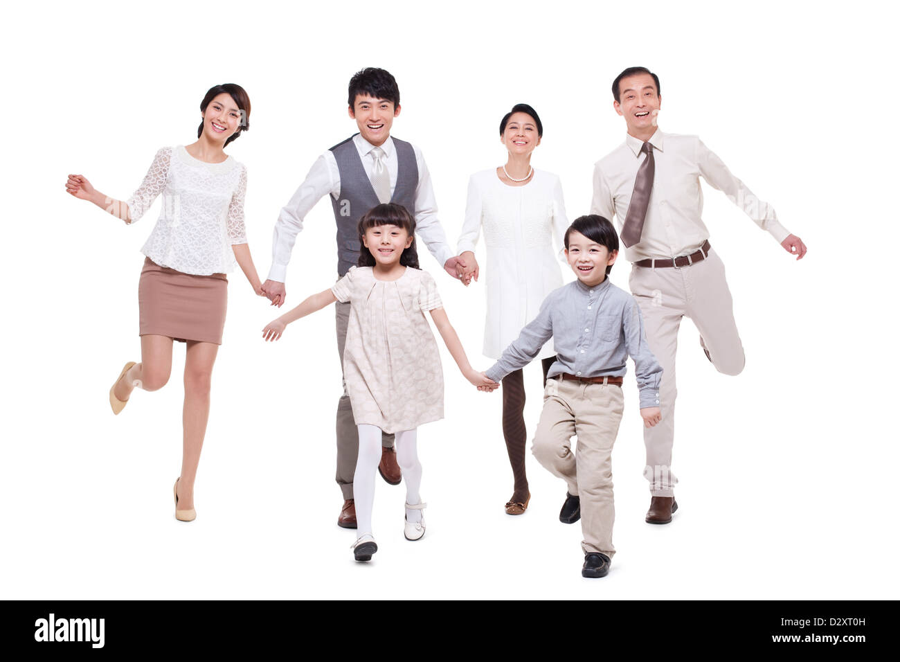 Cheerful family stepping forward Stock Photo - Alamy