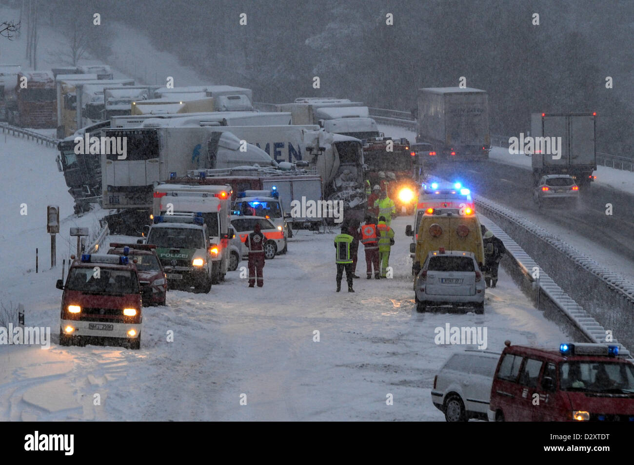 Relief forces stand at the scene of an accident with a coach on the ...