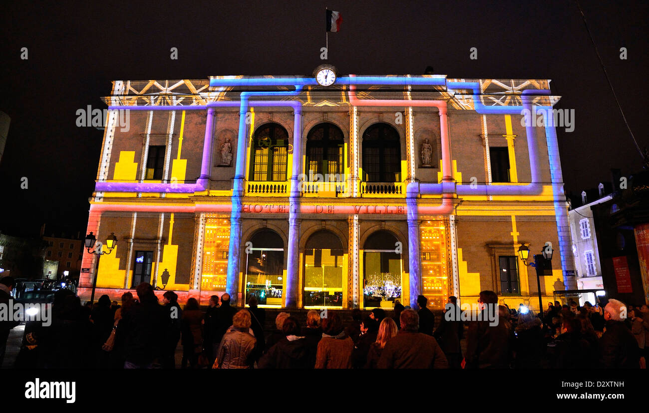 City illuminated during Christmas, many people at night in the down ...