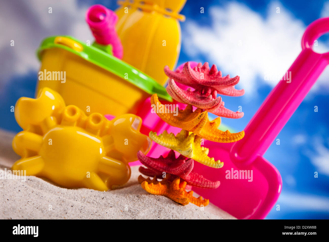 Colorful plastic toys on the beach Stock Photo - Alamy