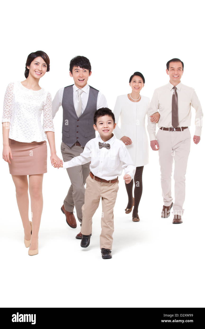Happy family stepping forward Stock Photo - Alamy
