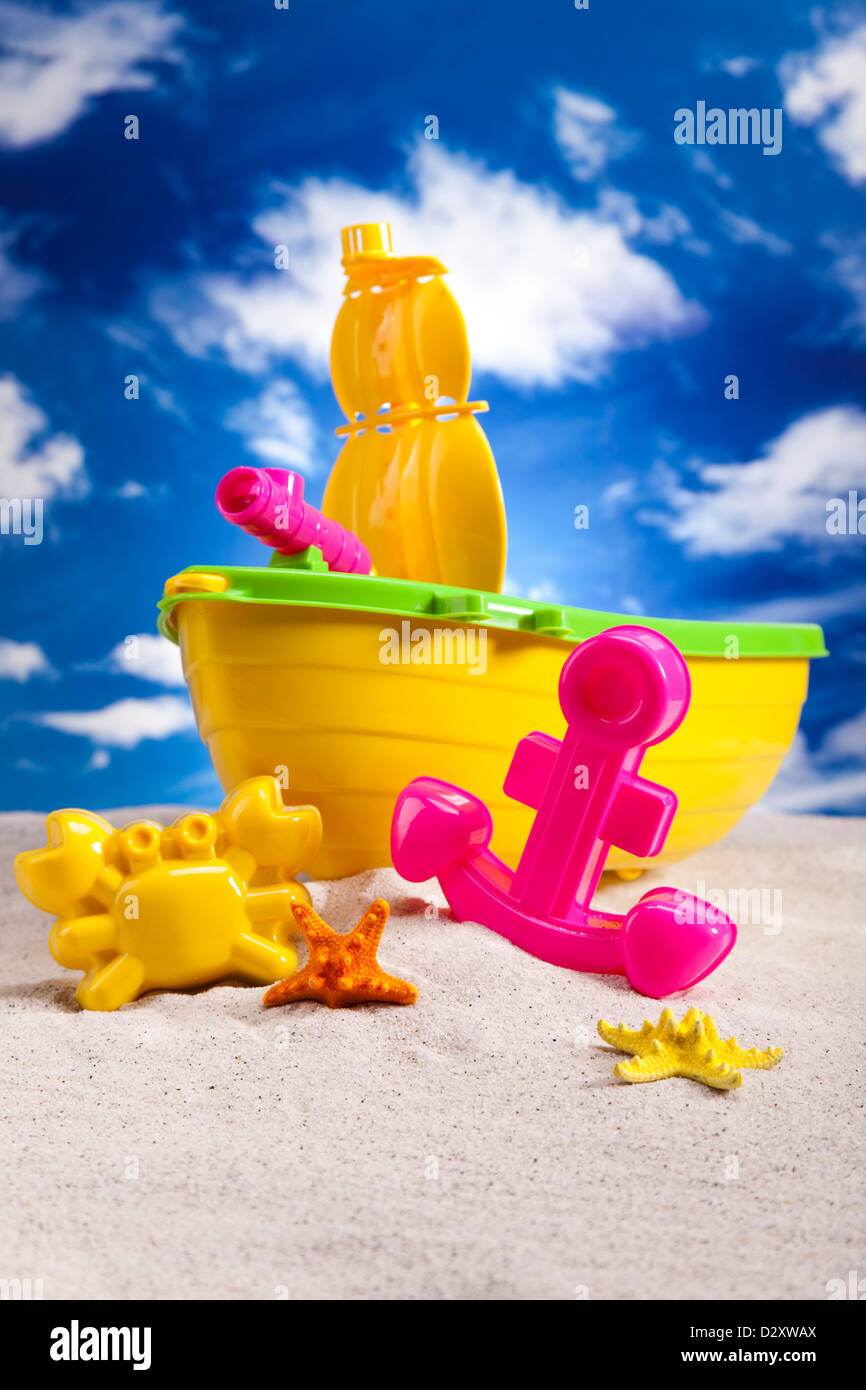 Colorful plastic toys on the beach Stock Photo - Alamy