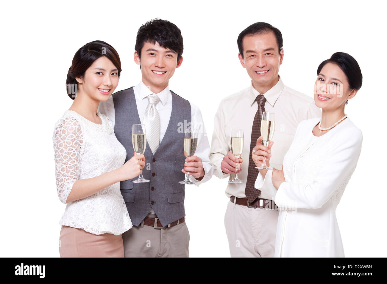 Well-dressed family having champagne Stock Photo - Alamy