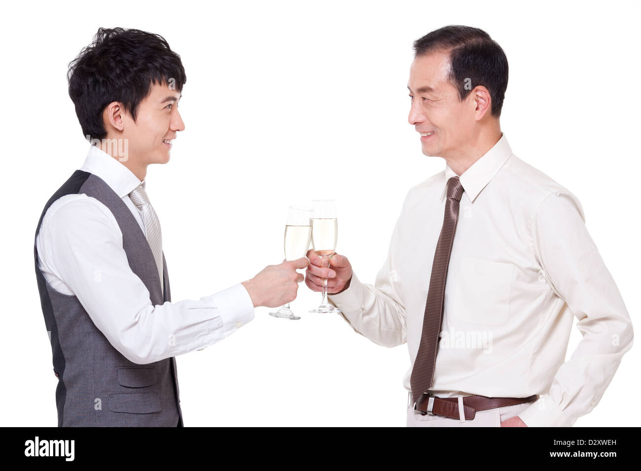 Businessmen with champagne flutes toasting Stock Photo - Alamy