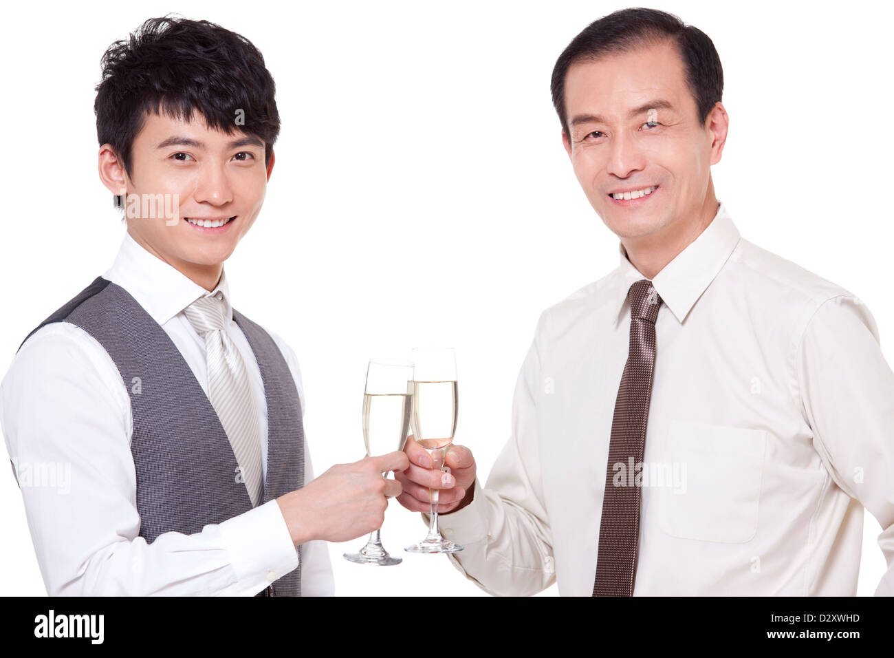 Businessmen with champagne flutes toasting Stock Photo - Alamy