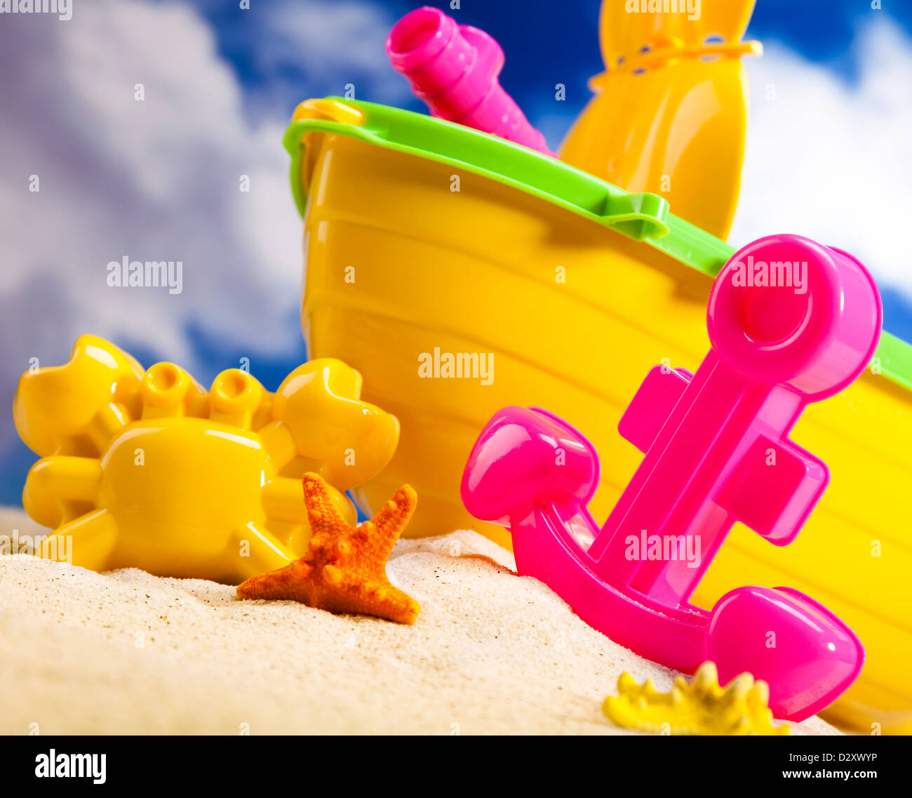 Colorful plastic toys on the beach Stock Photo - Alamy