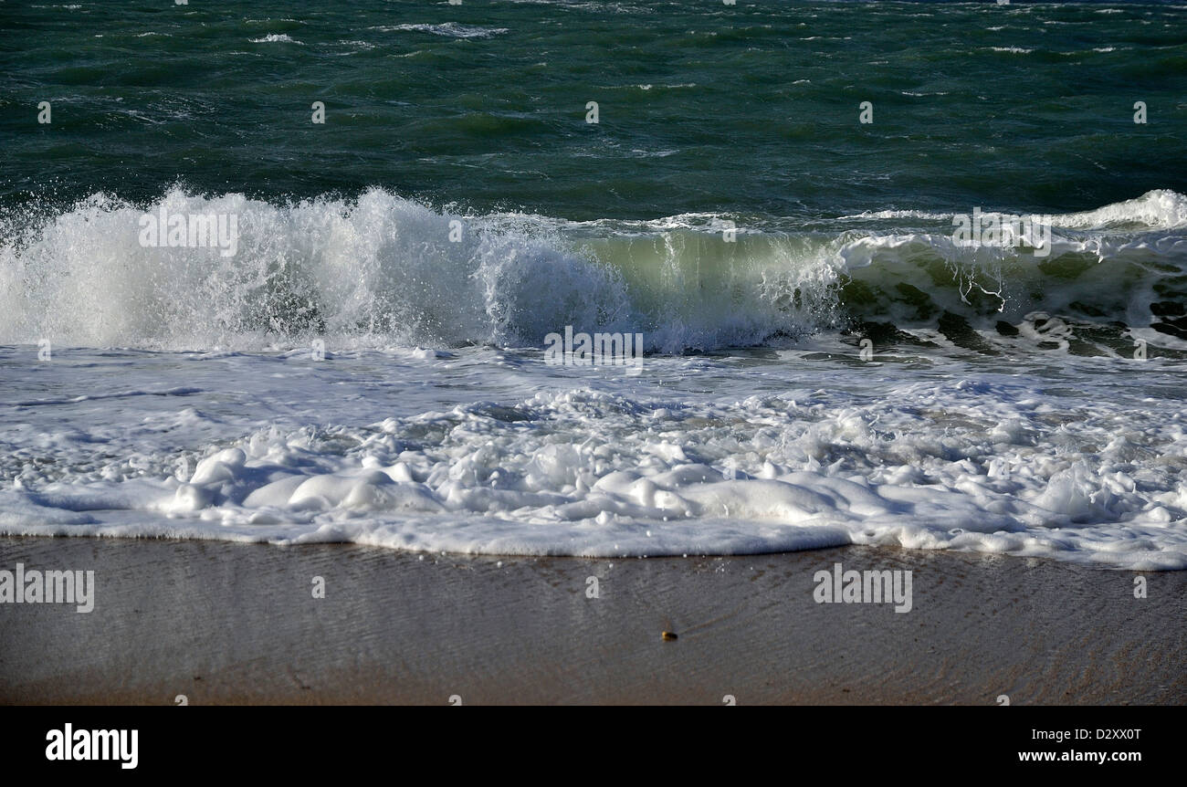 Backwash, in flood tide, breaking waves, swash and backwash over ...