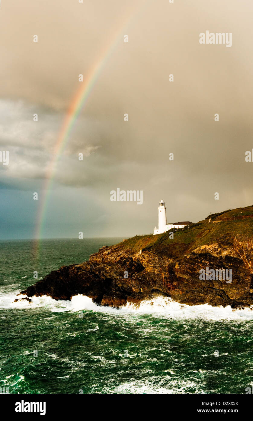 A rainbow over Trevose Head Lighthouse on a stormy day with a choppy ...