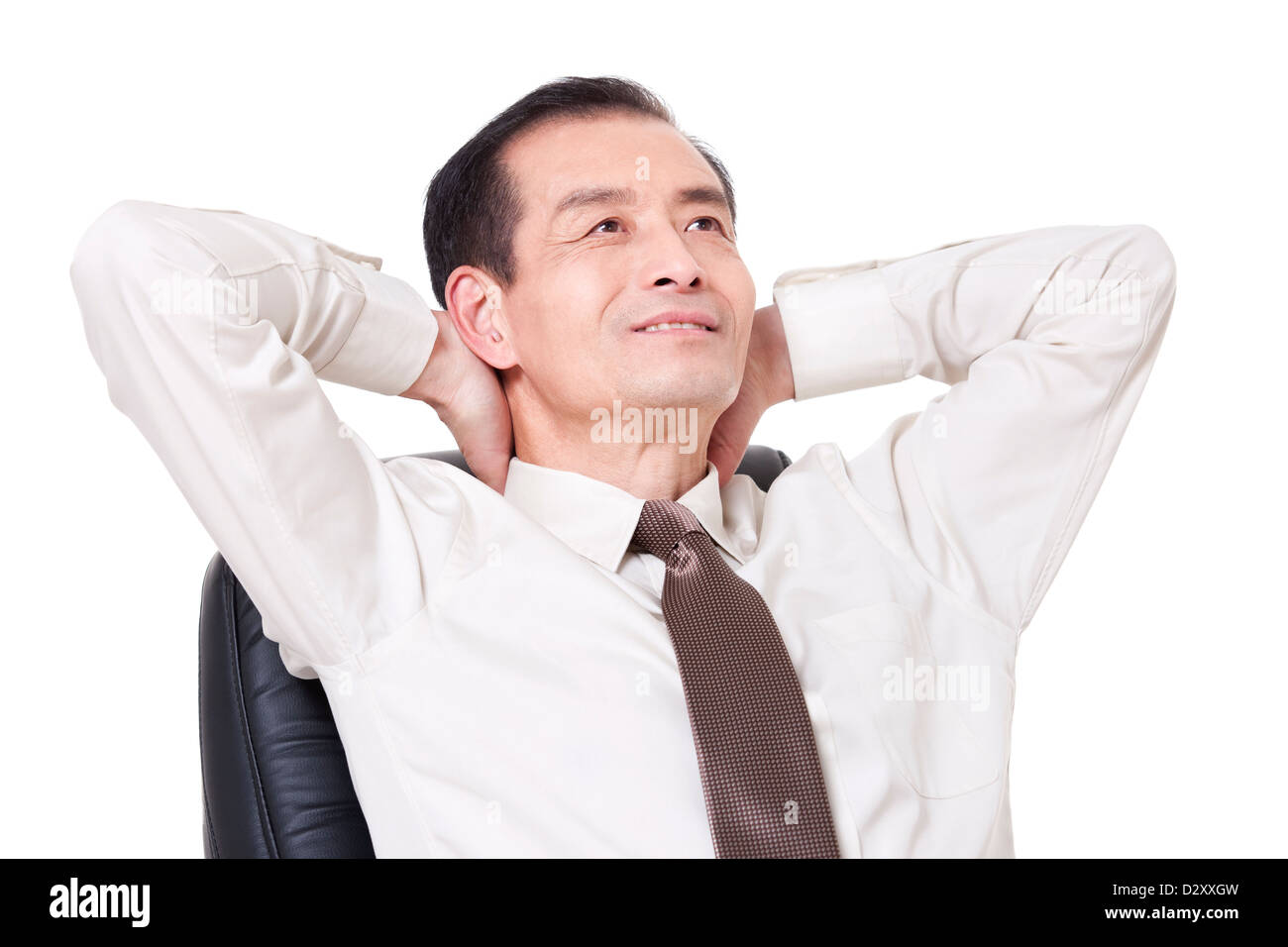 Senior businessman leaning back in office chair Stock Photo - Alamy