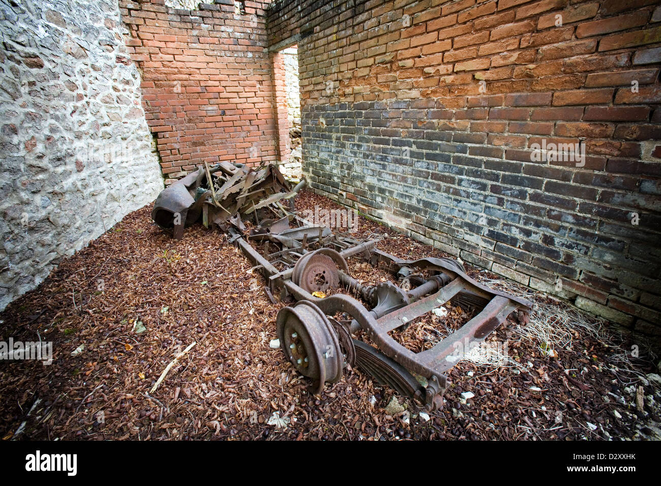 A fully destroyed car in the ruins of a garage in the destroyed French ...