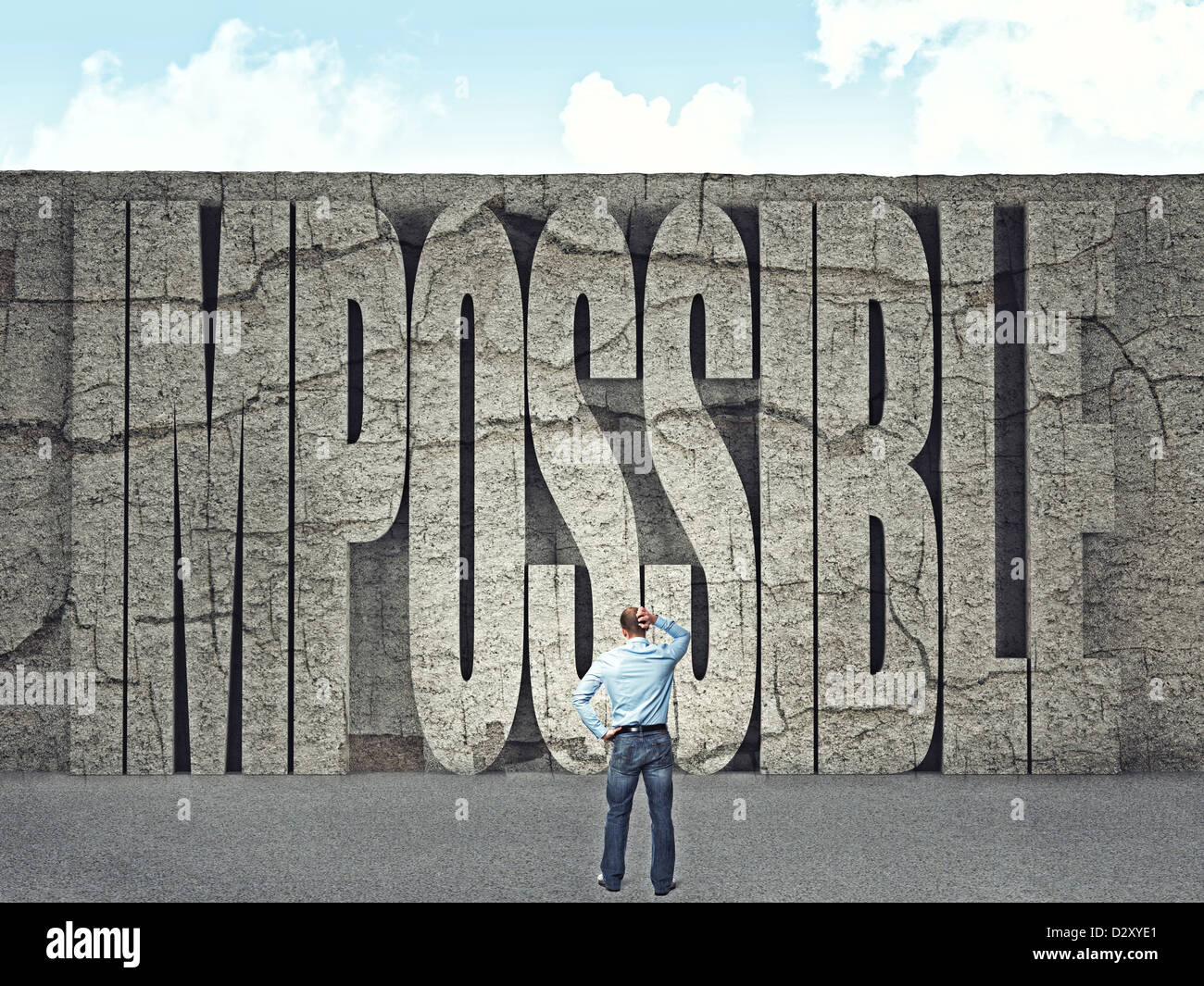 man look huge wall with impossible text Stock Photo - Alamy