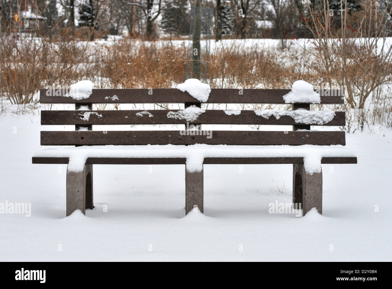 A snow-covered park bench Stock Photo - Alamy