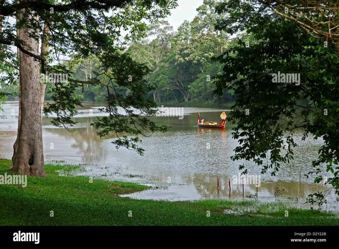 Tourist boat navigating in the moat. Angkor Wat. Cambodia Stock Photo ...