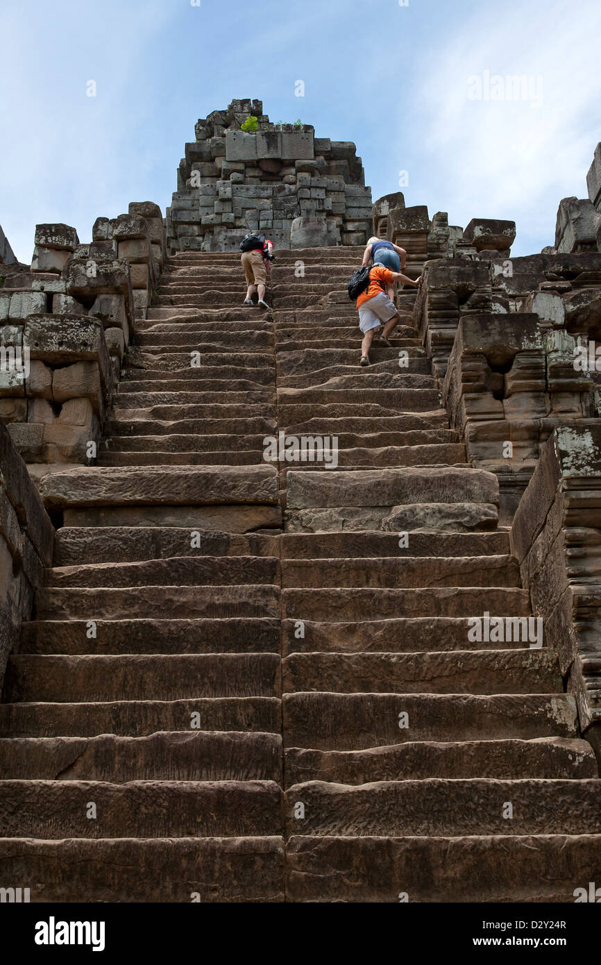 Tourists climbing the steps. Ta Keo temple.Angkor. Cambodia Stock Photo ...