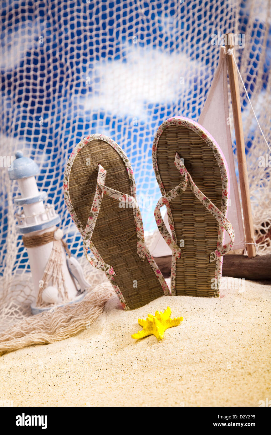 Flip flops and sand Stock Photo - Alamy