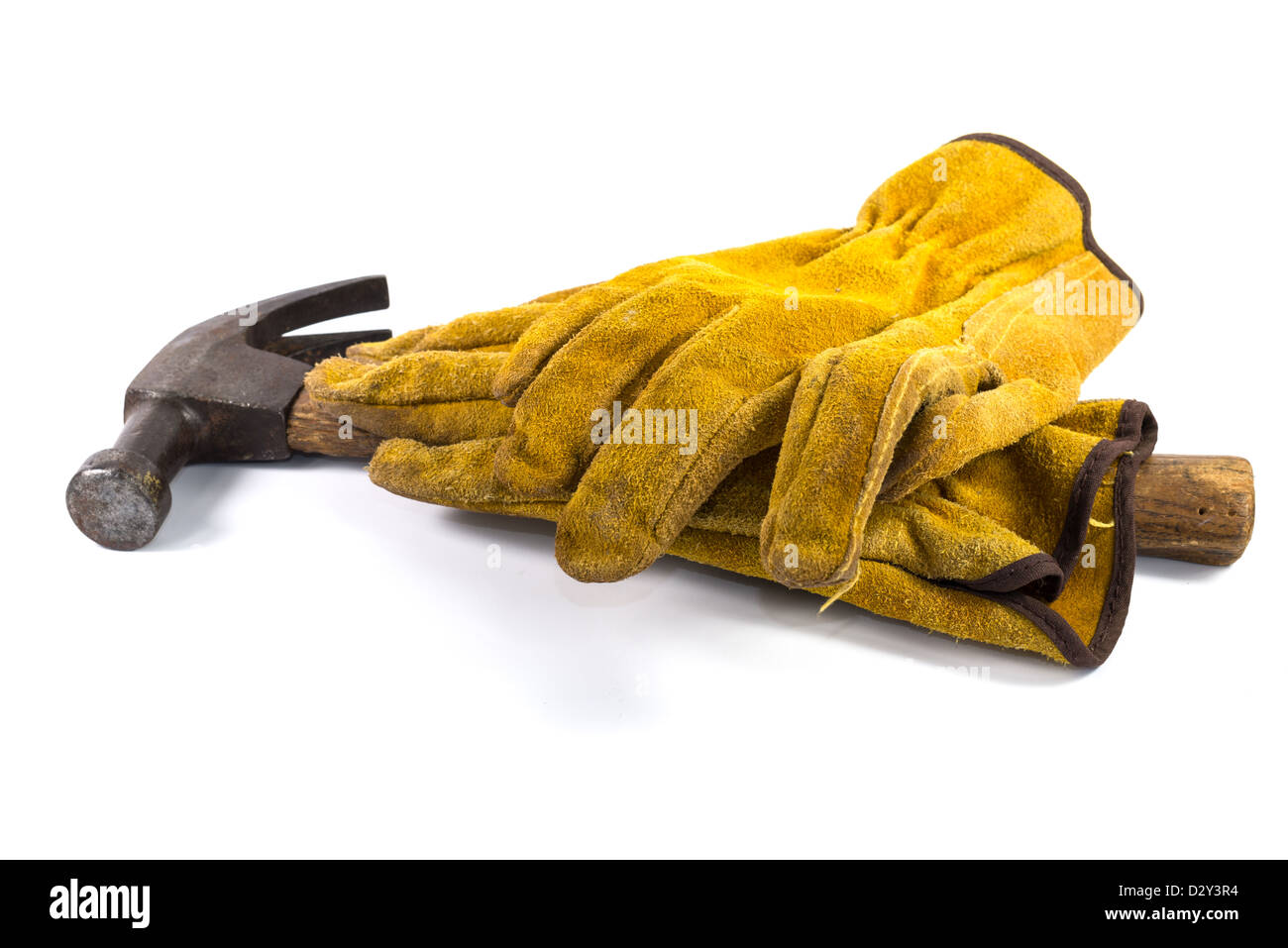 Well worn tan leather work gloves showing the texture of suede sits on ...