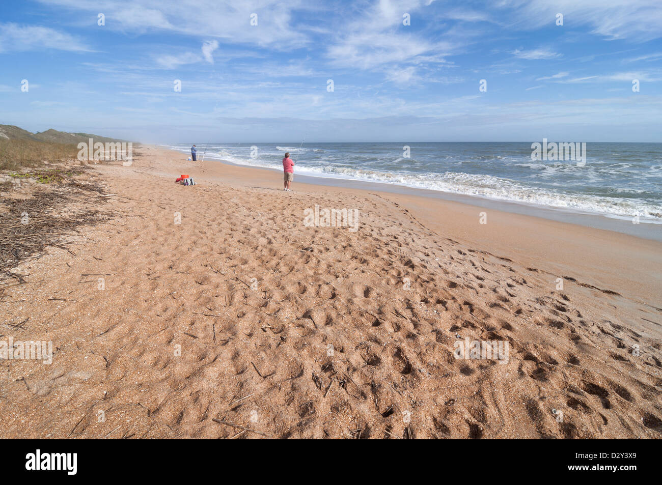 Surf fishing the Atlantic ocean at a beach along coastal North Florida ...