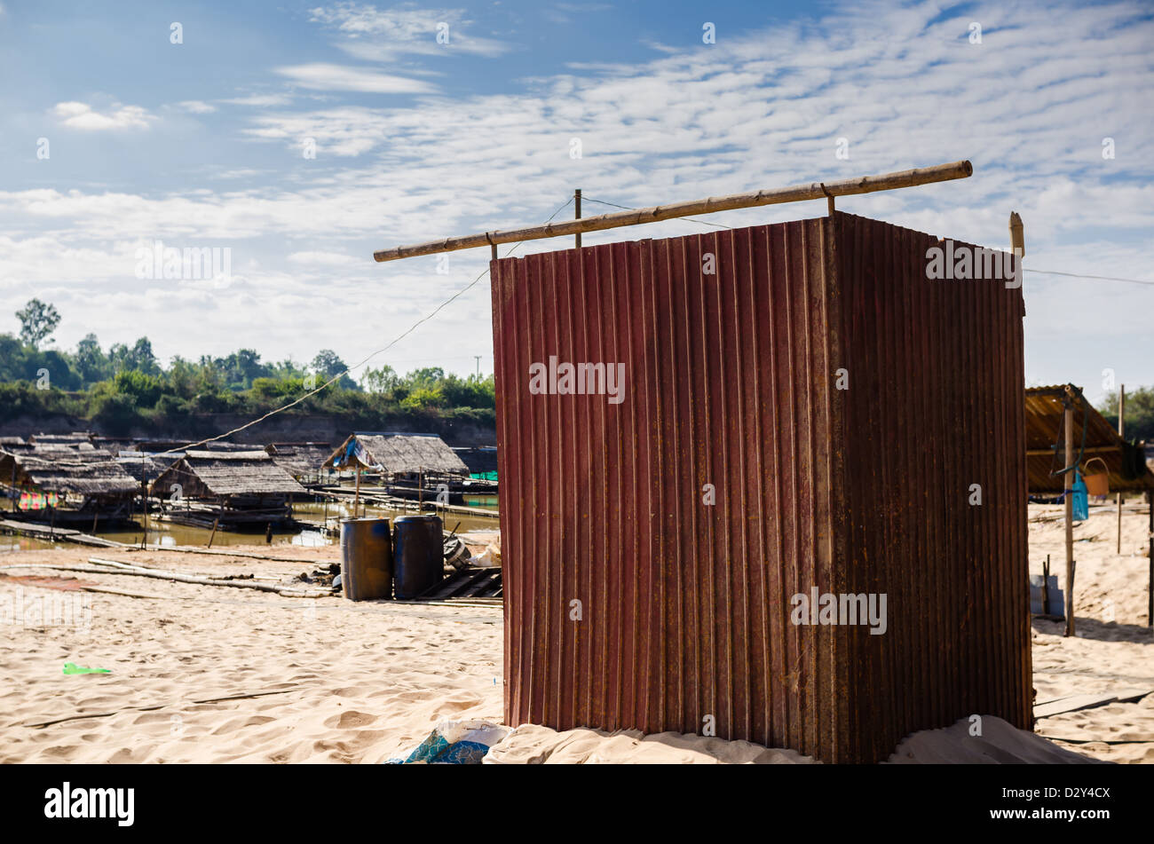 Outdoor toilet on the sand beside the river Stock Photo - Alamy