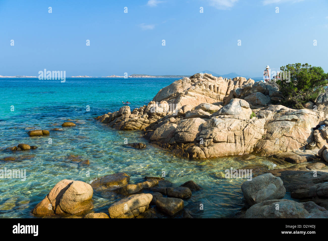 Italy, Sardinia, tourists on the cliffs of Cala di Volpe Stock Photo ...
